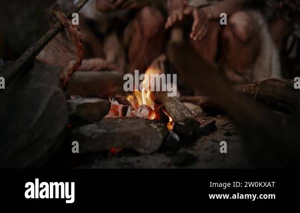 Tribe of Prehistoric Hunter-Gatherers Wearing Animal Skins Live in Cave ...