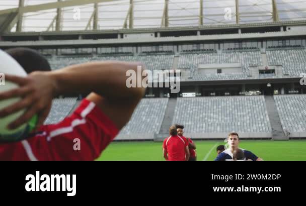 Front view of diverse rugby players playing rugby match in stadium ...