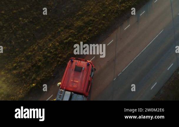 Aerial View: Rescue Team of Firefighters and Paramedics Work on a Car ...