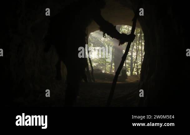 Primeval Caveman Wearing Animal Skin and Fur Holds Stone Tipped Spear ...