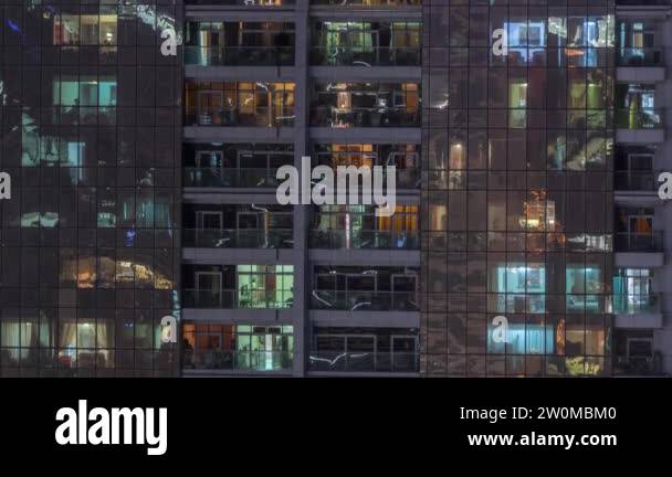 Night view of exterior apartment building timelapse. High rise ...