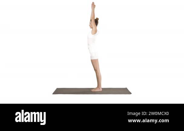 Beautiful young woman doing yoga exercise for ankles, calves, thighs ...