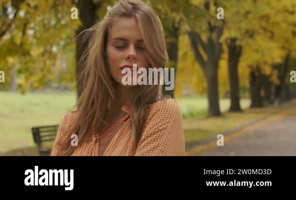 Portrait of pretty Caucasian lady with long brown hair and green eyes ...