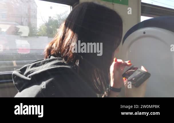 Girl in train and a smartphone. Travel transportation railroad concept ...