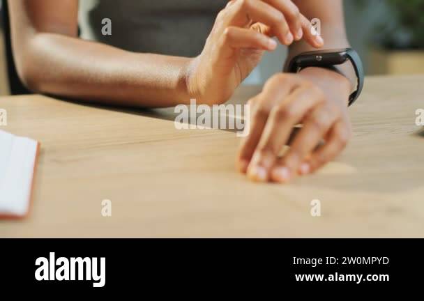 Close up of African American woman hands scrolling and tapping on the ...