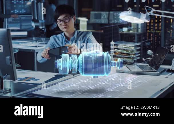 Industrial Engineer Works with Smartphone Using Augmented Reality Holographic Projection 3D ...