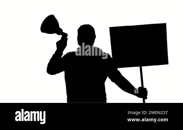 black silhouette of protester holds a megaphone and a poster, shouts ...