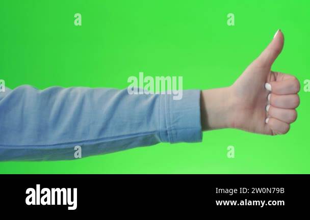 Thumbs up sign hand gesture on green screen. Simbol of approval like ...