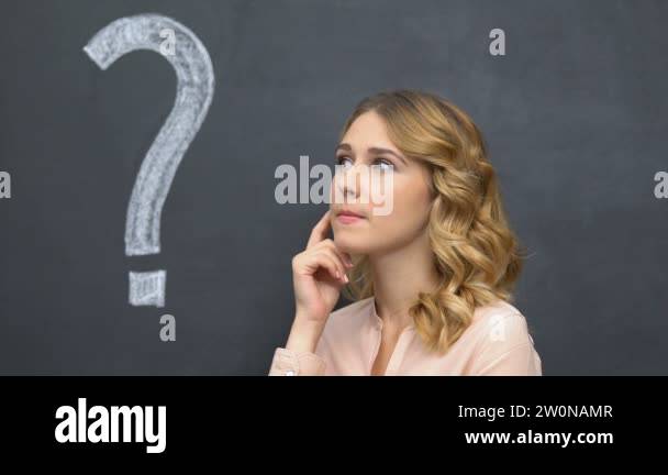 Question mark written on blackboard, pensive woman thinking, making ...