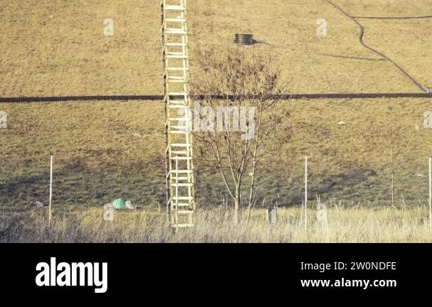 Garbage dump, landfill of municipal waste with protective net on steel ...