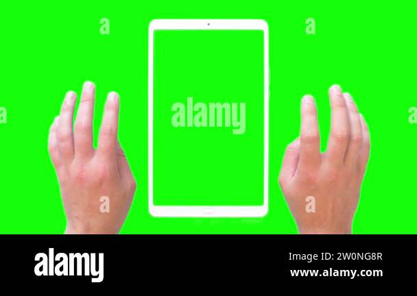 Men's hands knock on the surface with a tablet. Green screen footage ...