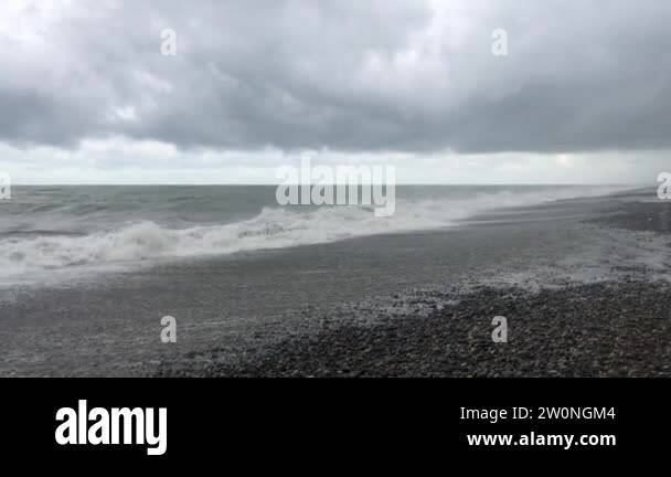 Storm at sea, storm warning on the coast. Thunderclouds and big sea ...