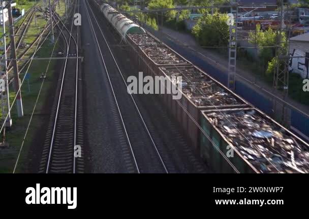 Freight train carries cargo. View of the train from above. Rail transport for intercity trade ...