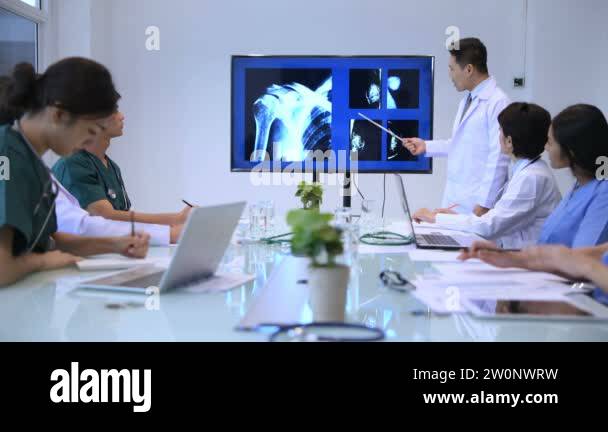 Medical concept. The doctor is explaining the shoulder muscles x-ray on ...