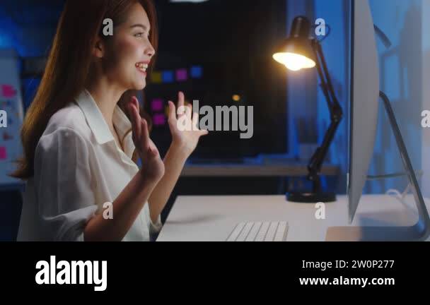 Asia businesswoman using computer talk to colleagues about plan in ...