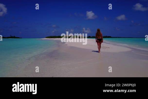 video the tan girl in bikini walking on sea scythe thinking about ...