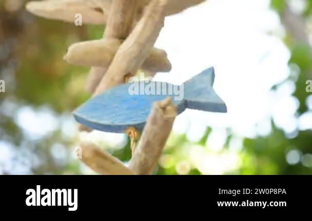 Wooden fish simbol. Wooden fish hanging on the rope. Fish symbolizing ...