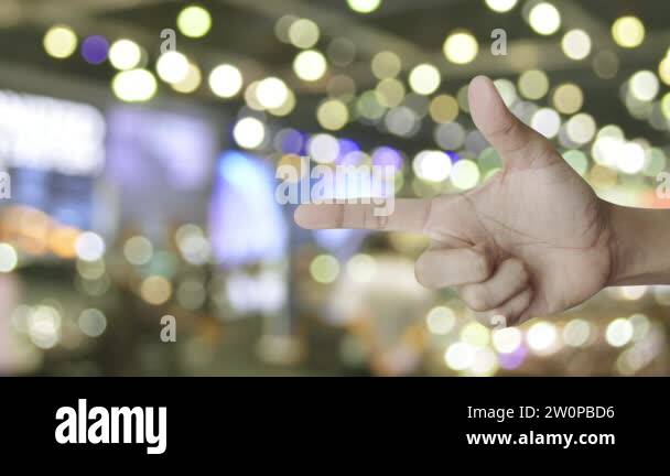 Question mark sign icon on finger over blur light and shadow of ...