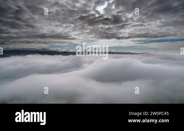 Cinematic 8K 7680x4320.Two different layers of cloud time-lapse.Above ...