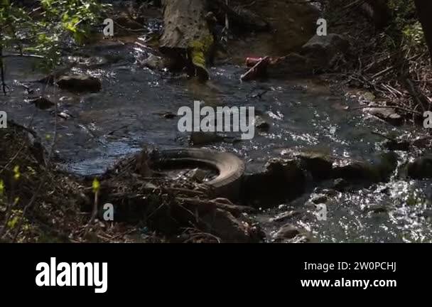 Water pollution in river with trash Stock Video Footage - Alamy
