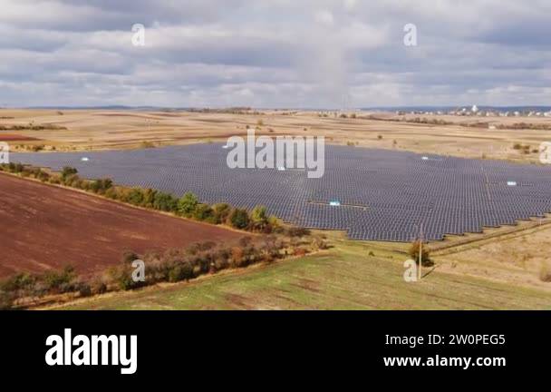 Zoom aerial view of Solar Panels Farm (solar cell) with sunlight. Drone ...