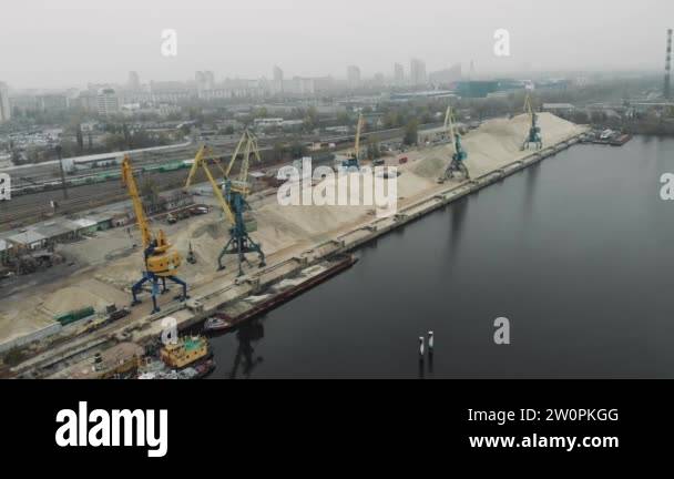 Industrial part of the city with cargo construction cranes and old ...