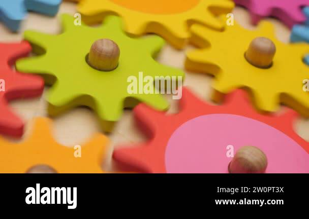 Working for common goal, conceptual. Gears and cogs in action. Side top ...