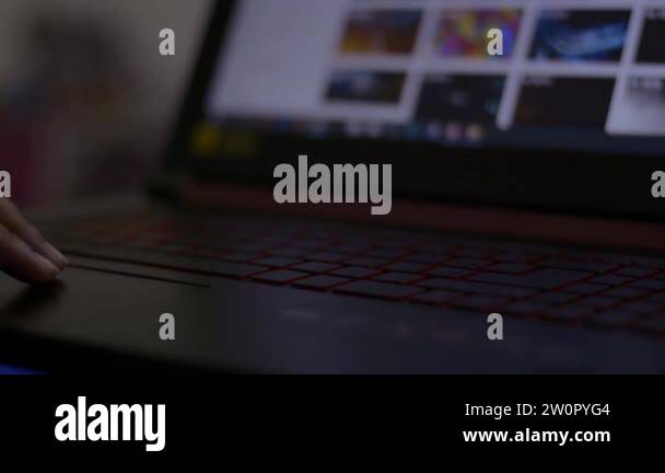 Close up hand of woman scrolling a Website Using Laptop Track Pad ...