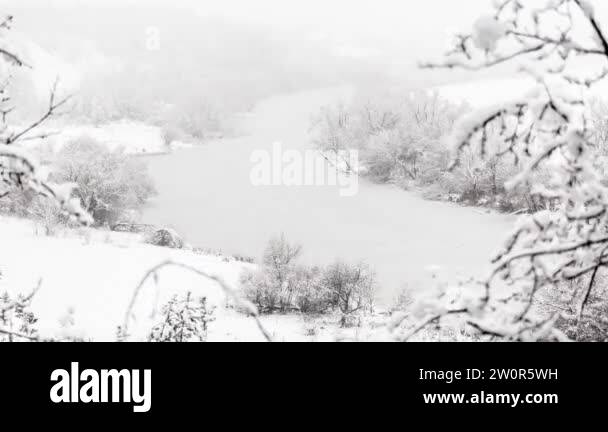 Time lapse 4k. Winter snowfall over the frozen river Stock Video ...