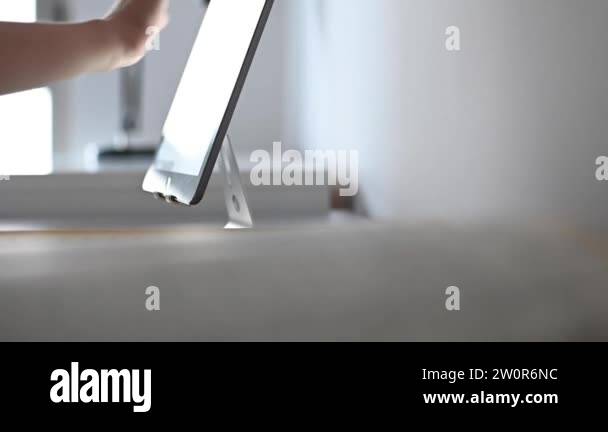 Boy tapping on a tablet doing exercises. Stress kid doing homework.Boy ...