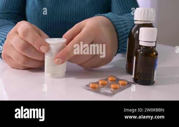 blind female opens medicament that says braille and puts it in arm ...