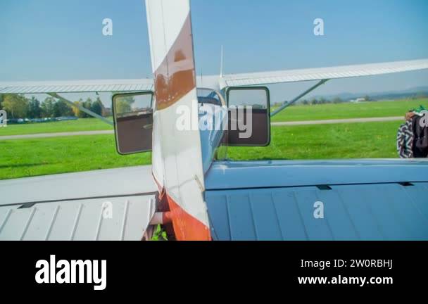 Doors of the small airplane are open and soon passangers will board the ...