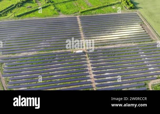 Solar panels power plant from drone. Blue panels stands in row on the ...