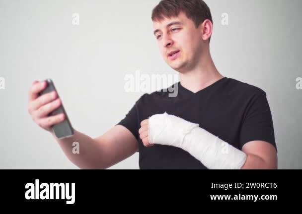 Telemedicine. Broken arm. Patient with bone fracture communicates on ...
