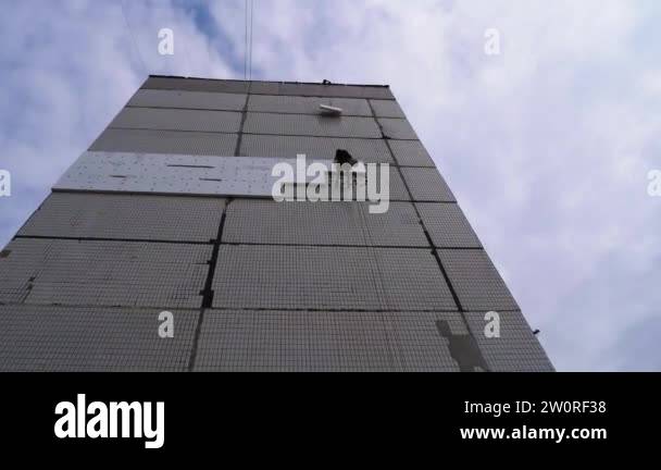 Industrial Climber Insulation of Facade Old High-Rise Building Using ...