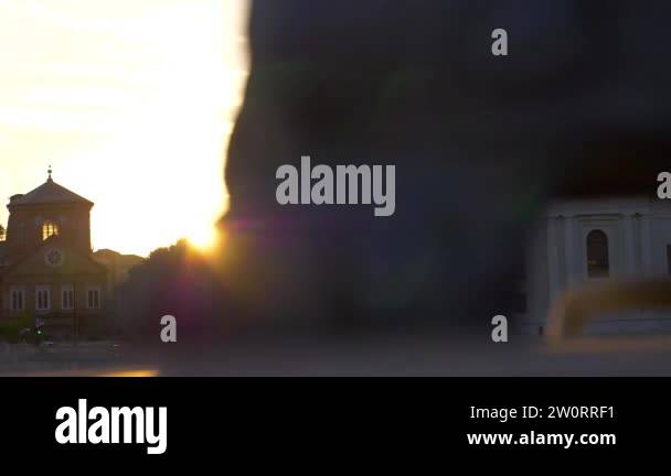 LENS FLARE: Bright golden sun rays shine past the historic cathedral in ...