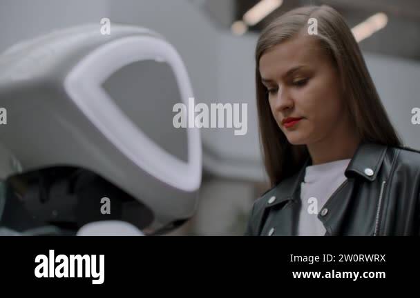 The robot looks at the girl. Artificial intelligence. Modern robotic ...