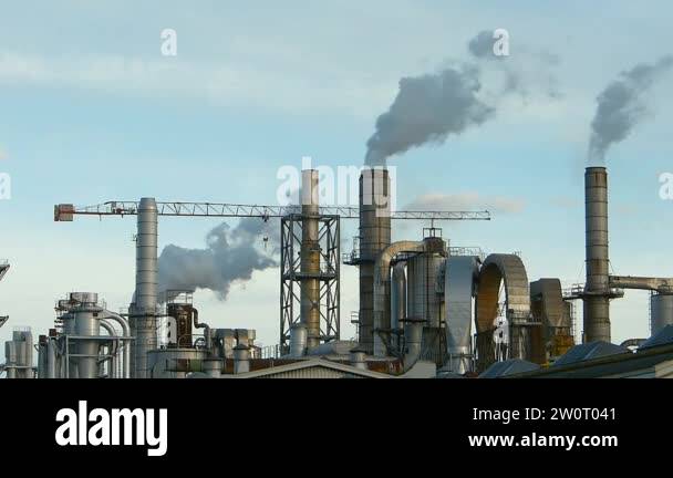 Smokestacks of a factory emits smog. Chimneys of a chemical plant. Pipe ...
