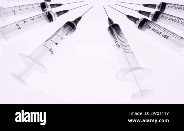 Medical injection syringes turning around close up. Concept Of Medicine ...