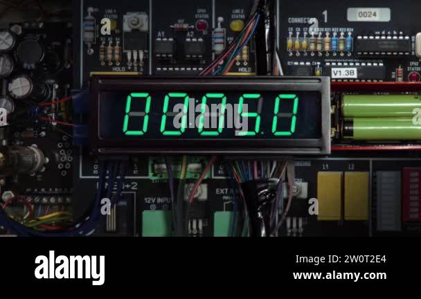 Bomb detonator with digital green numbers and 7 seconds countdown. Slow ...