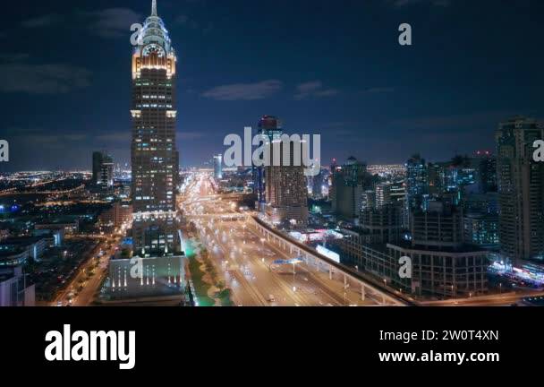 Skyline internet city with crossing Sheikh Zayed Road aerial night view ...