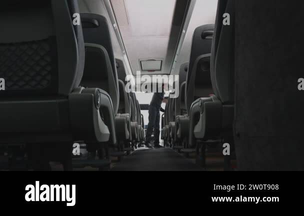 Coach Bus Operator Checking Aisle Seats And Storage Compartments After ...