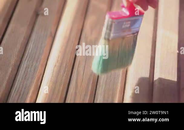 Close-up woman hand whisk dust from wood batten board Stock Video ...