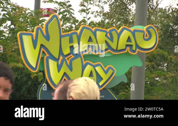 Visitors to Aquatica Waterpark in Orlando Walking-by Signage of a Water ...