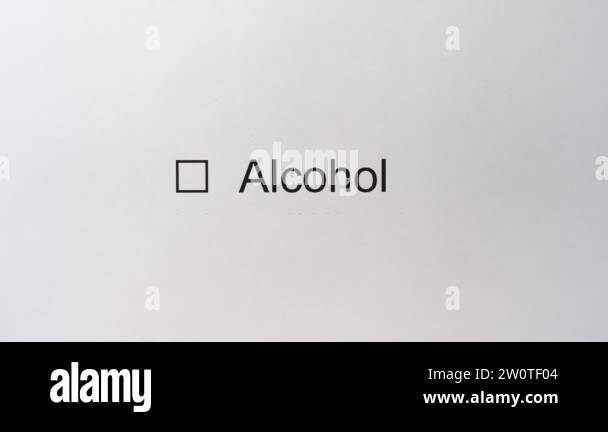 Checkbox Alcohol with a tick. Man hand draws a check mark in the field ...