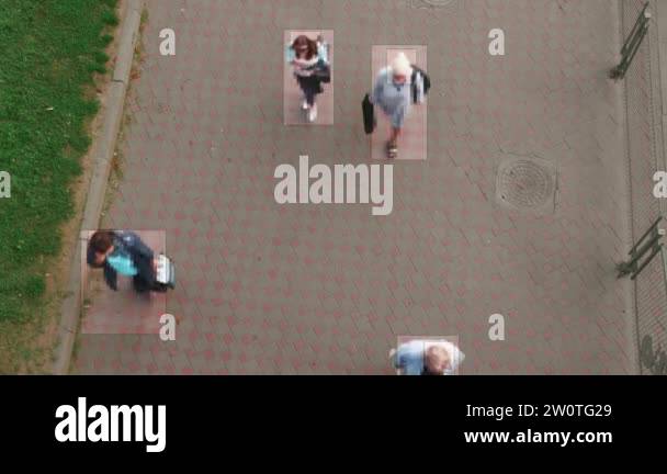 High view camera of people walking. Facial recognition interface scans ...