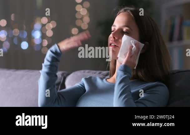 Stressed woman suffering heat stroke sweating and drying with a tissue ...