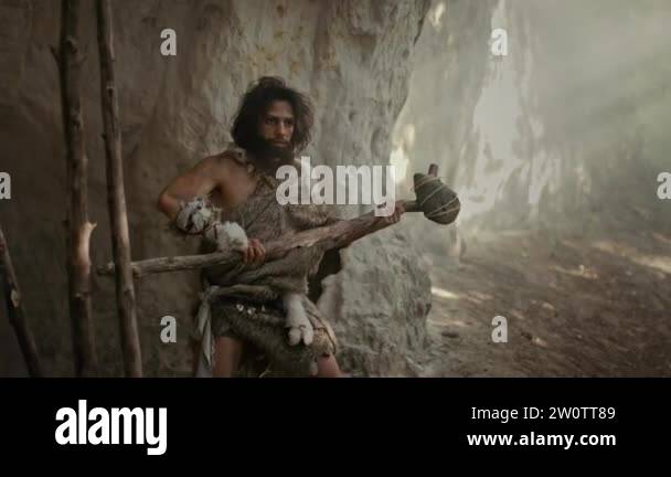 Primeval Caveman Wearing Animal Skin Holds Stone Tipped Hammer Comes ...