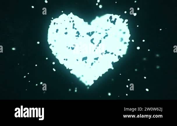 flying fluid and liquid particles form heart symbol on dark background ...