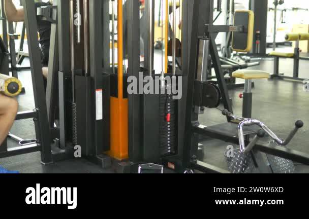 blurred background, general plan of the gym. athletes do traction of ...